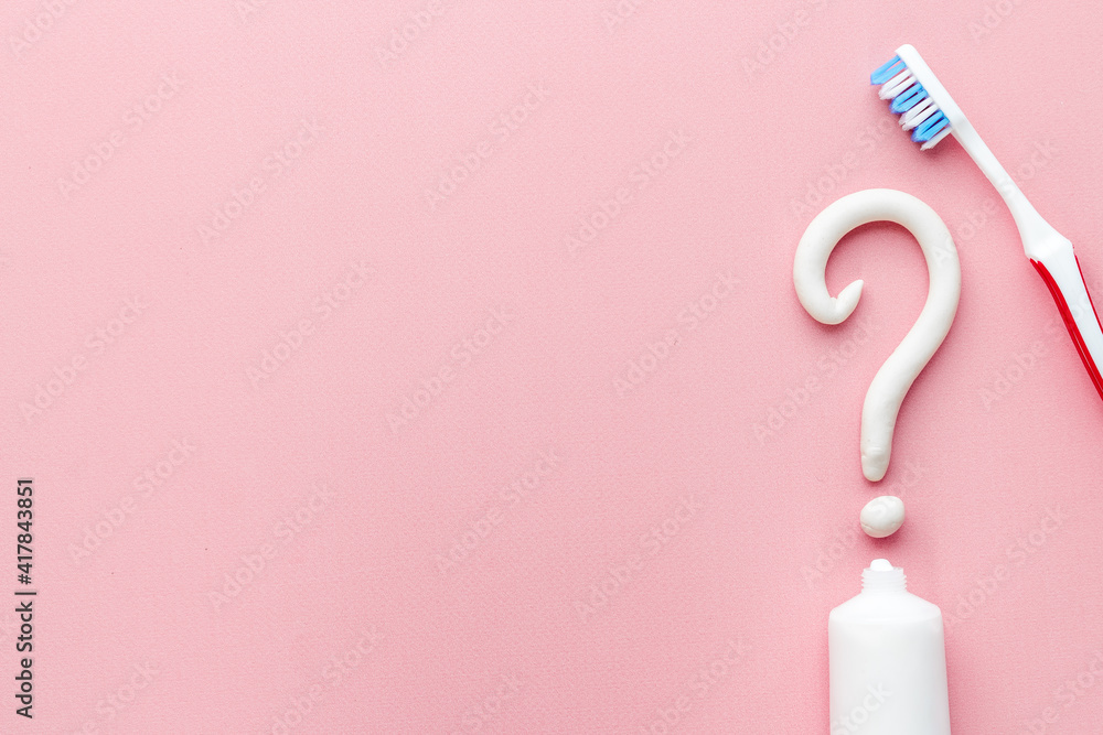 Question mark of toothpaste with toothbrush, top view. Oral care and ...