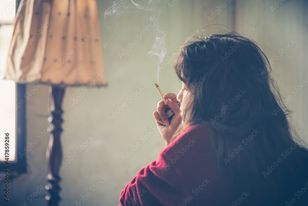 Stressed woman. A depressed woman smoking of stress Caused by social ...