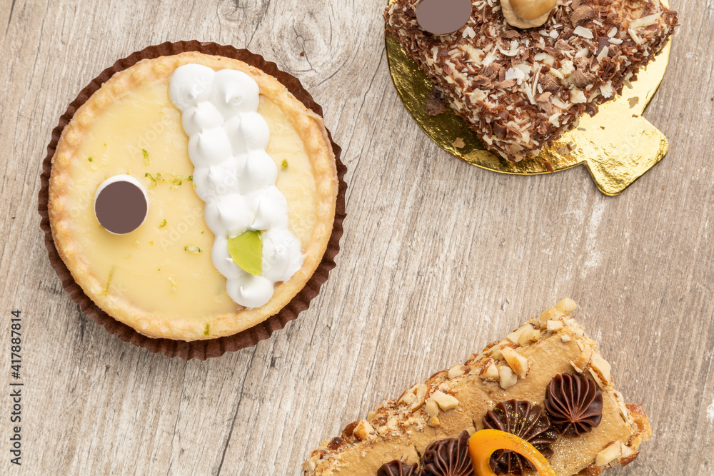 detail of the texture of various desserts, including pieces of cake and ...