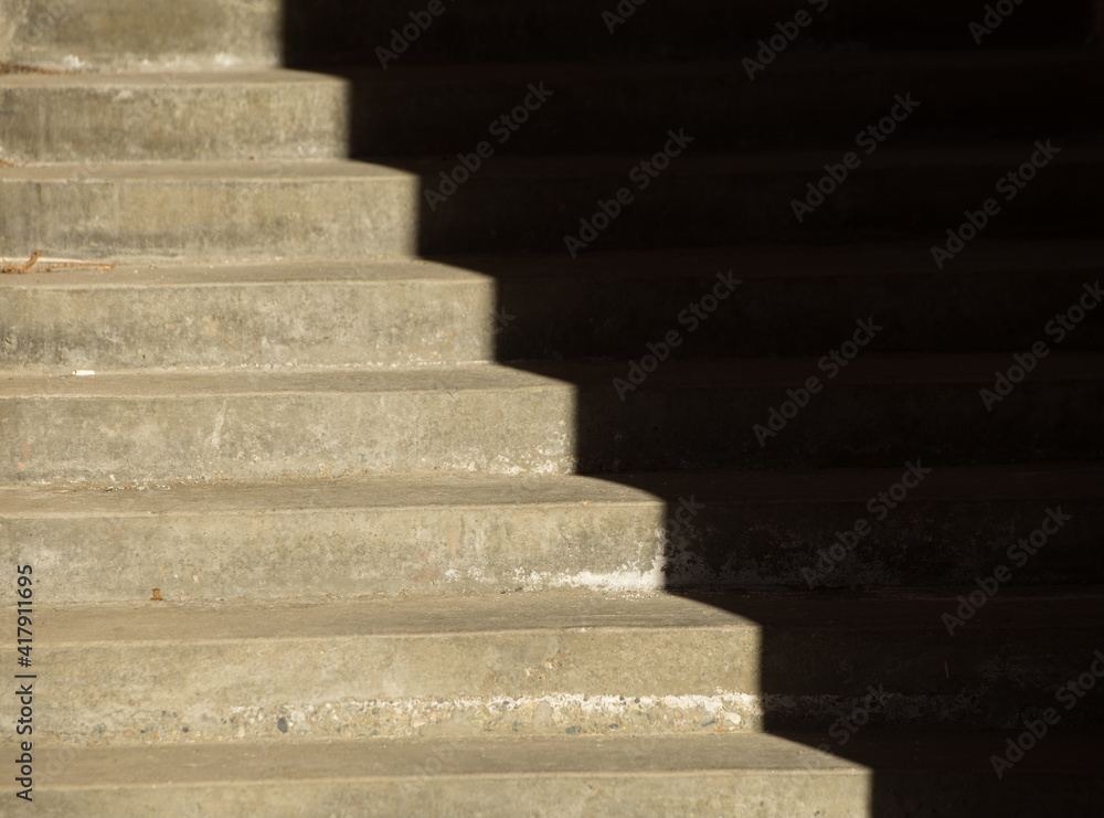 stair case in shadow showing black ridges going up and down steps black ...