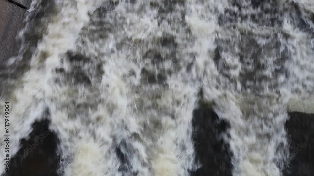 Closeup monotonous powerful fast bubbling water stream top view, water ...