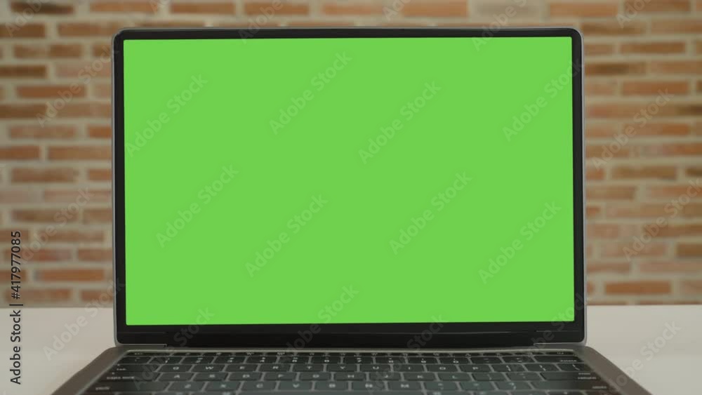 Close up display computer desktop with mock-up green screen on white ...