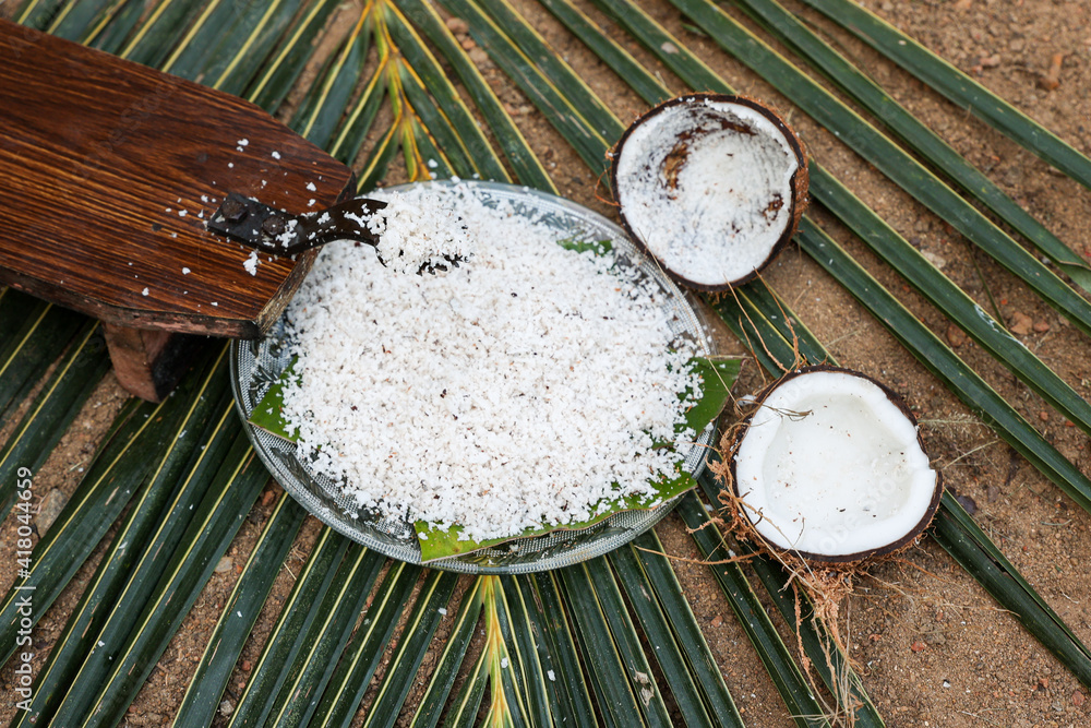 Hand grated fresh raw coconut cut open in half , Indian Kitchen ...