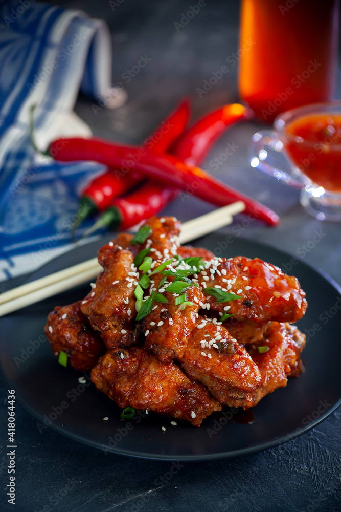 Red fried korean chicken on dark background Stock Photo | Adobe Stock