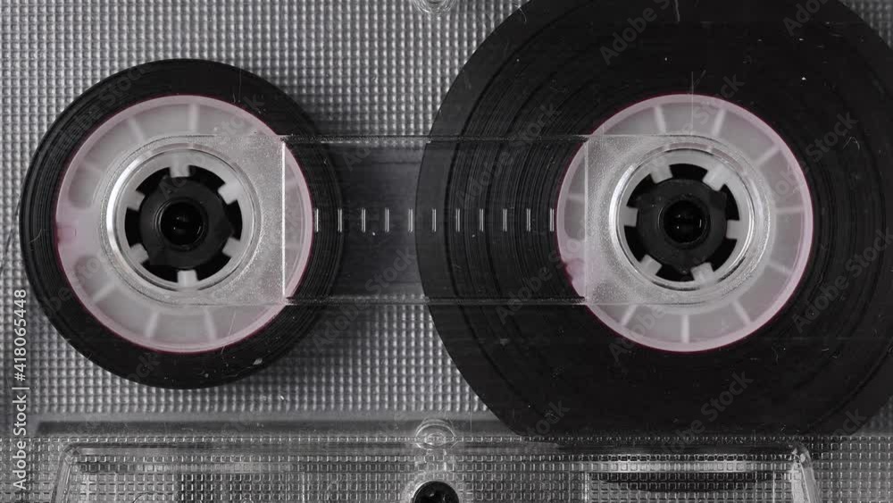 Close-up A tape recorder is playing an audio cassette. Close-up. A ...