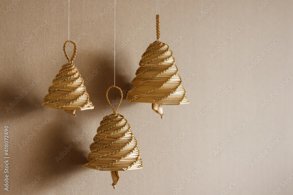 Bell made out of straw on a beige background. Straw bells decorations ...