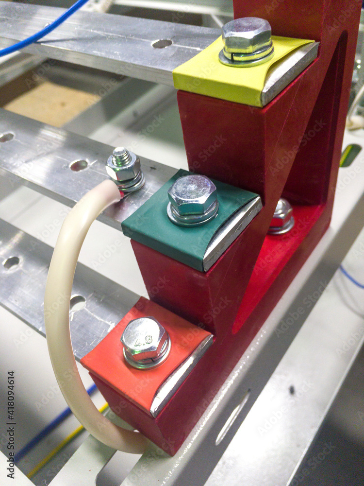 Phase busbars installation on a step insulator foto de Stock | Adobe Stock