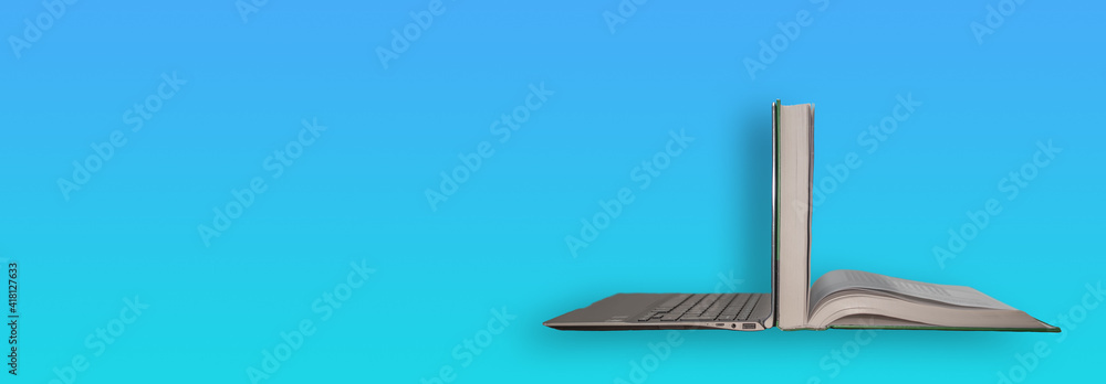 Banner with modern laptop computer positioned back to back with a thick ...