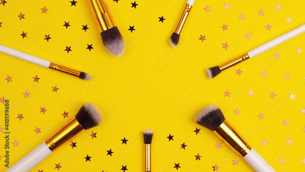 Stop motion animation of gold colored cosmetics white brushes set for ...
