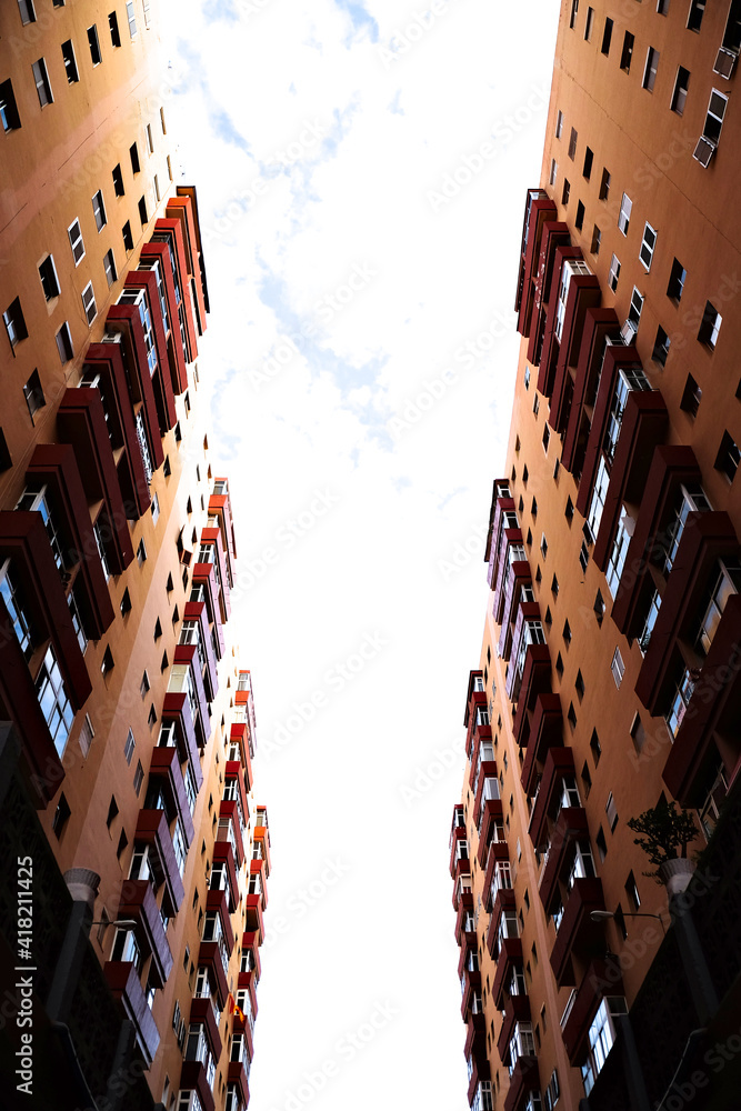 Tall riser multi storey apartment buildings in the city, looking up ...