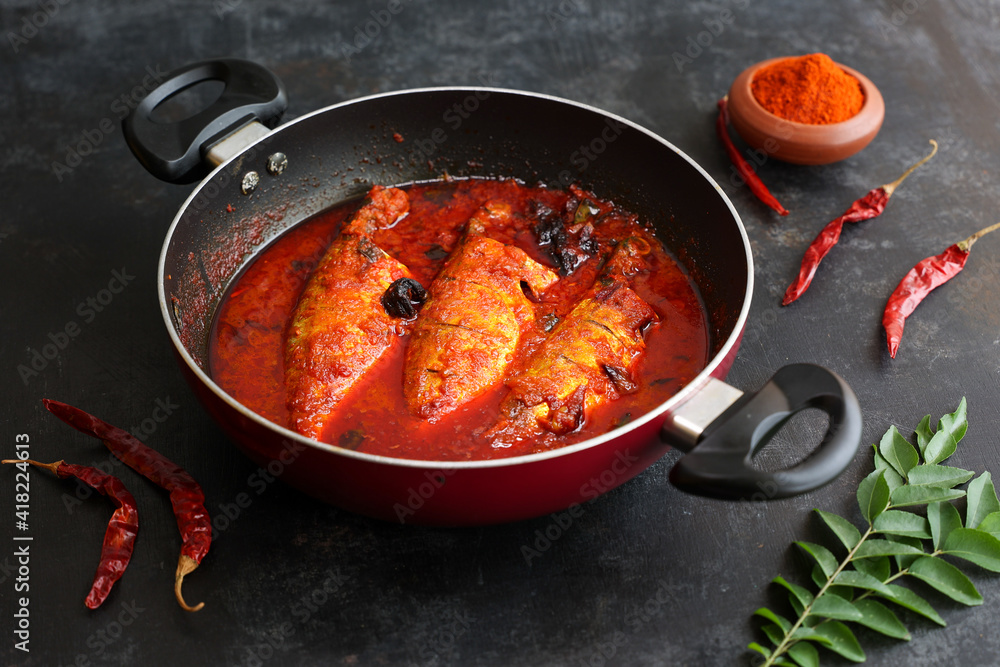 Spicy Mackerel fish curry gravy , cooking spicy Kerala fish curry ...