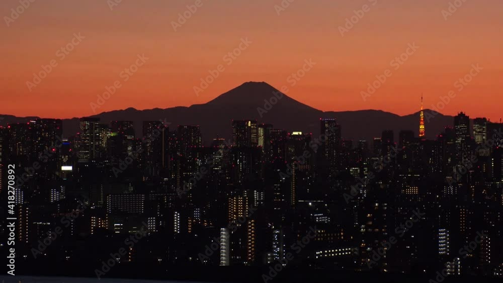 TOKYO, JAPAN : Aerial sunset CITYSCAPE of TOKYO and MOUNT FUJI. View of ...