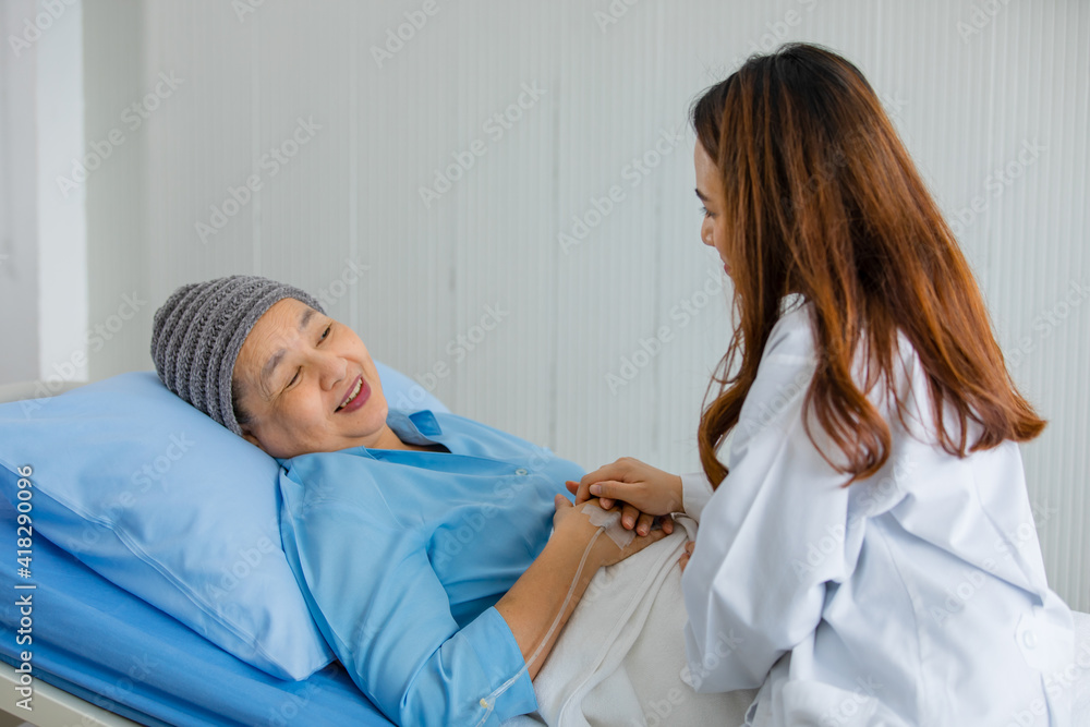 Older Asian woman patient covered the head with clothes effect from ...