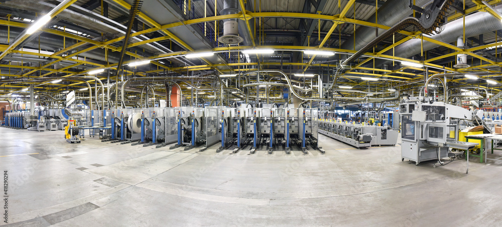 modern machines for transportation in a large print shop for production ...