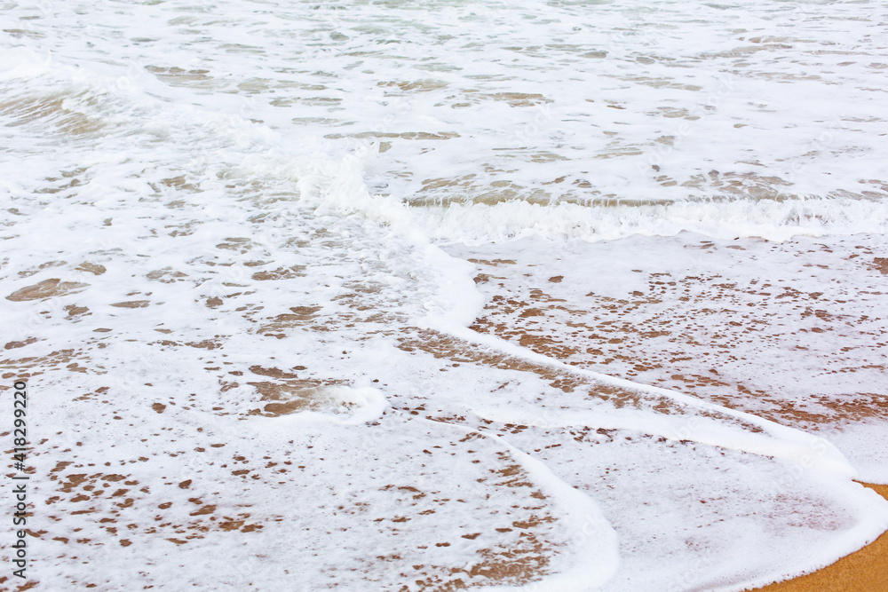 Water splashes on the coastal strip of the Mediterranean Sea with a ...