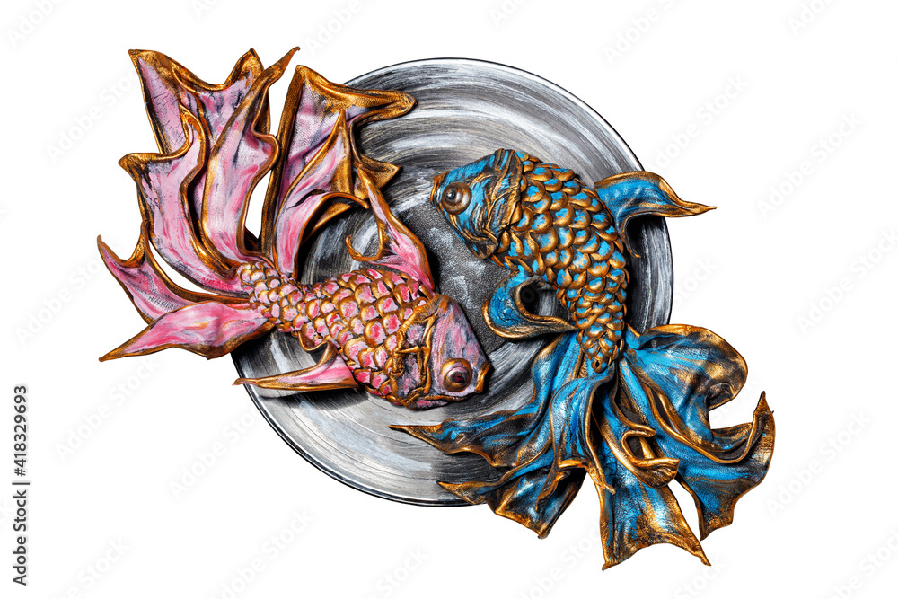 Two decorative fish as a symbol of unity of yin yang energies, isolated ...