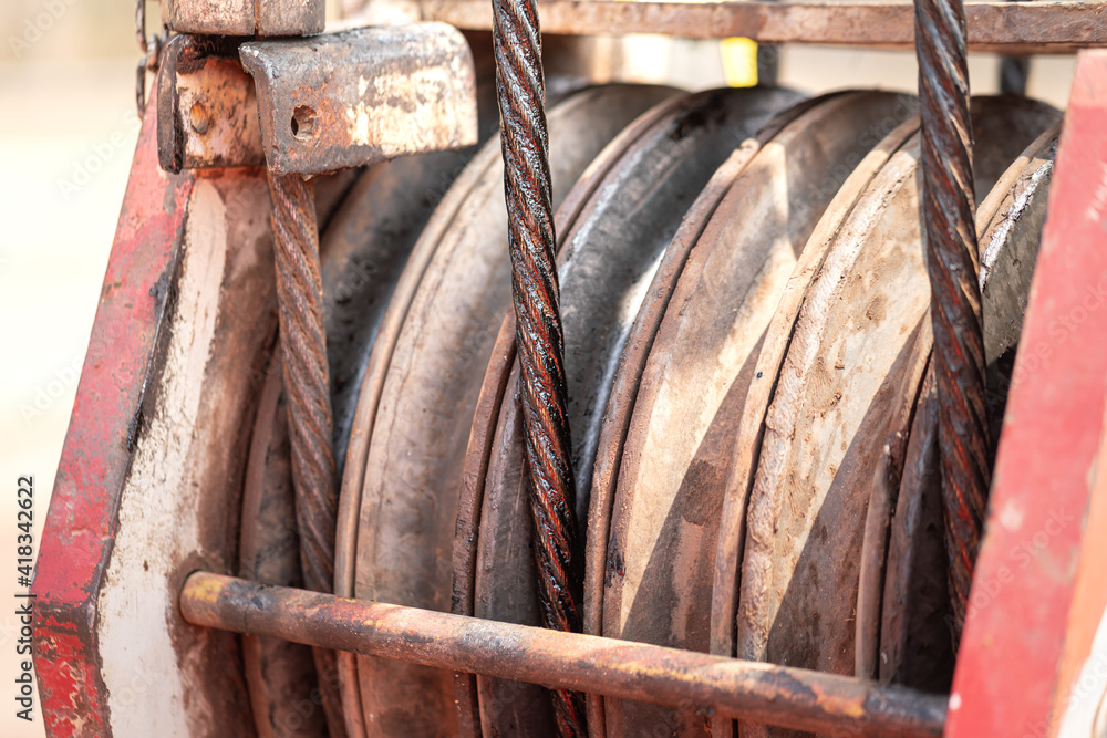 Wire rope sling and crawler drum of the lifting crane machine. Close-up ...