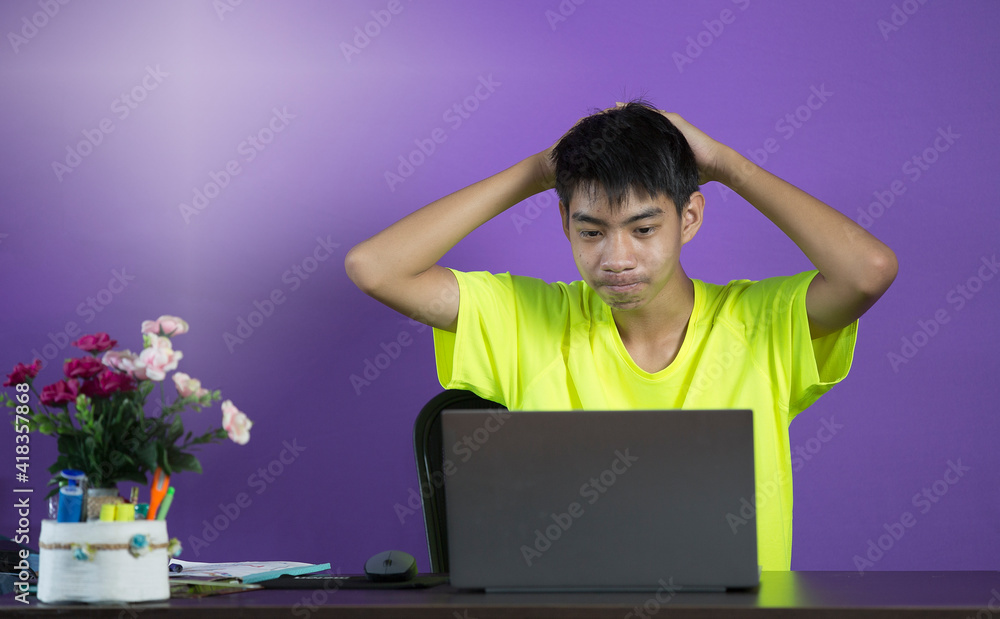 Young gamer man playing online game sitting over isolated purple ...