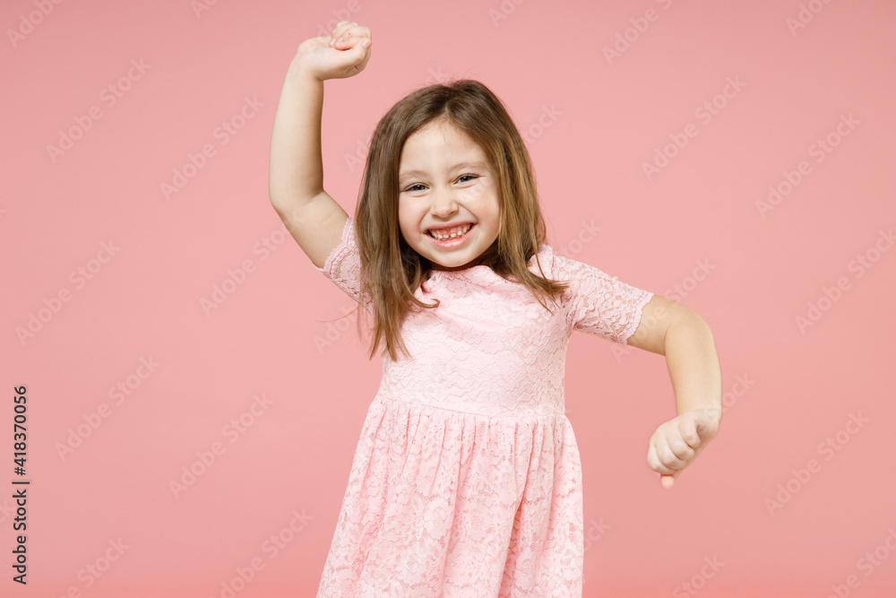 Little kid girl 5-6 years old wears rosy dress have fun dancing fooling ...