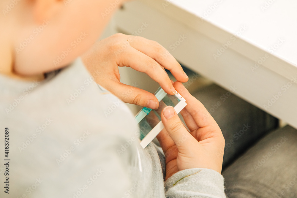 Child builds something out of small plastic parts. Fine motor skills ...