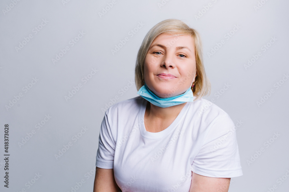 Senior doctor pulling down protective medical mask. Successful end of ...