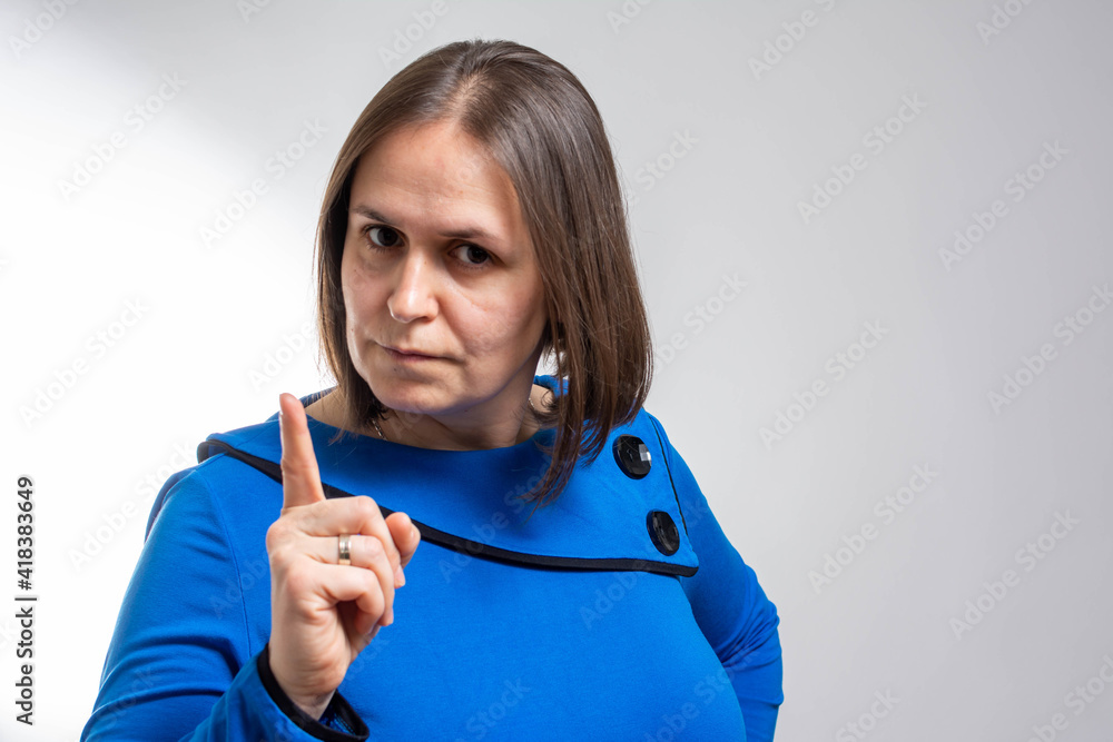 Woman gesturing a no sign. Closeup portrait woman raising finger up ...