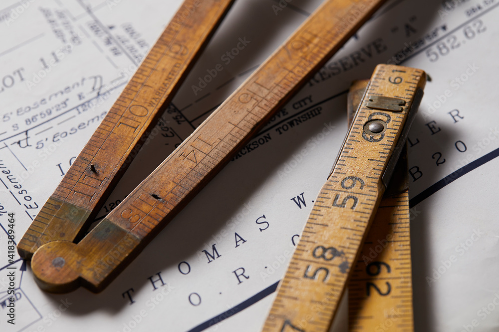 Vintage rulers on property map, close up Stock Photo | Adobe Stock