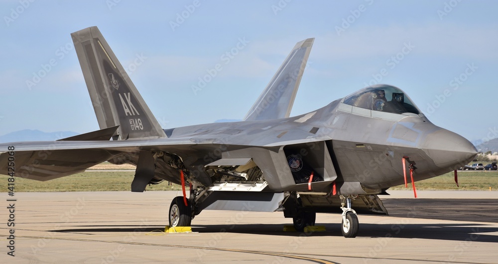 An Air Force F-22 Raptor fighter jet taxiing on a runway. Stock Photo ...