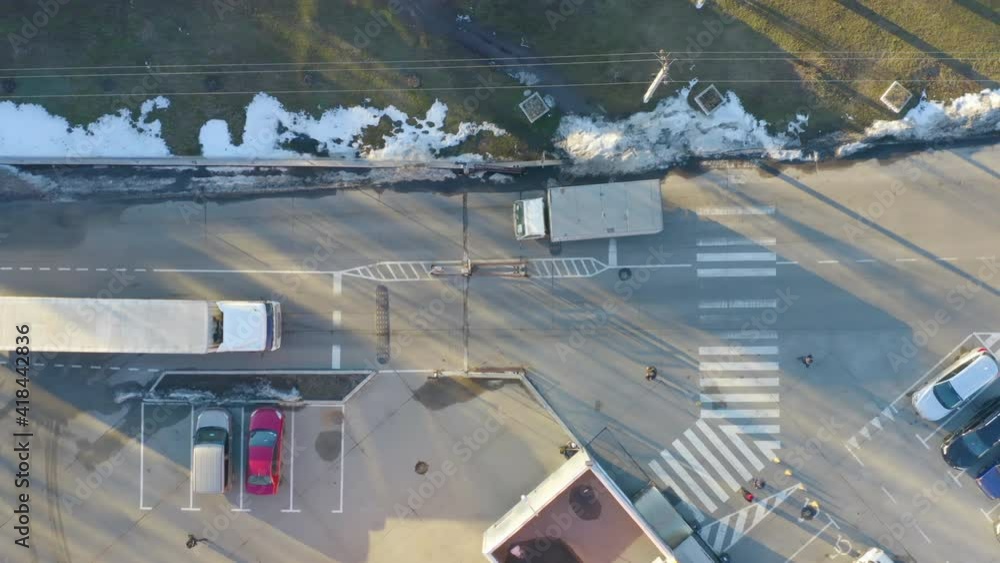 Aerial top down view of a semi-trailer truck is travelling along a ...