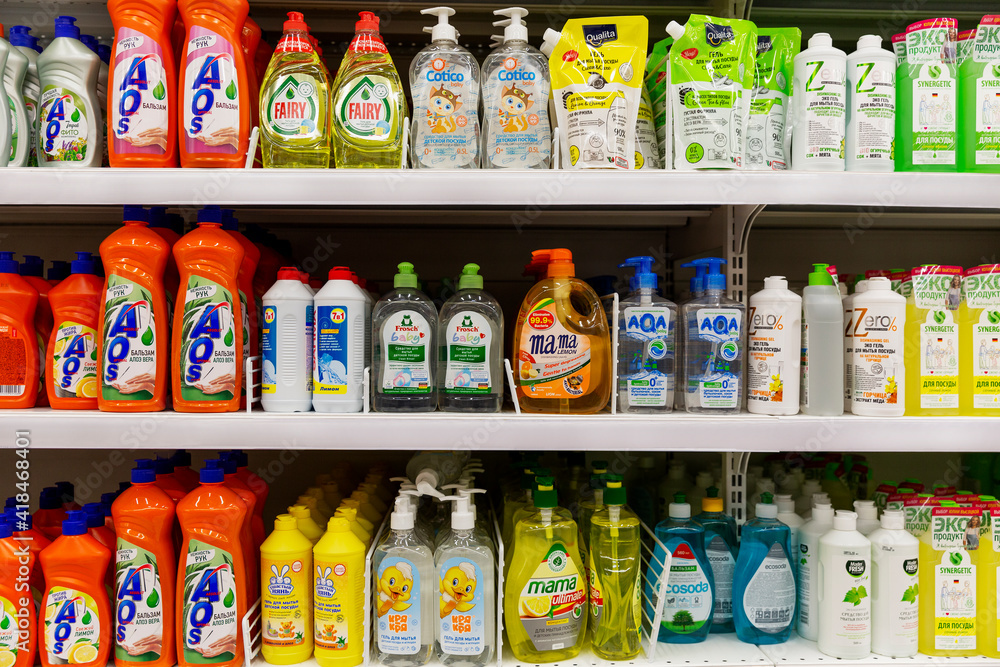 Dishwashing detergents of various brands in assortment on store shelves ...