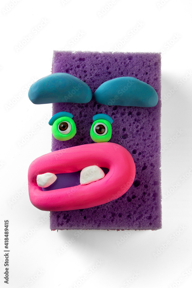 Animated sponge with eyes and lips by soft modeling clay. Stock Photo ...