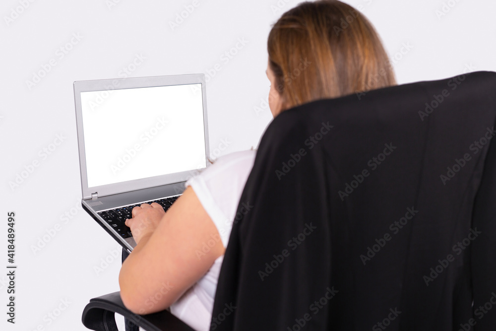 Rear photo of a large woman with a portable laptop. White screen. Work ...