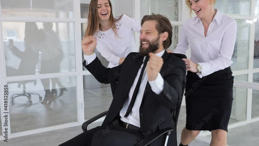 Joyful business team celebrating success. Three crazy happy colleagues ...