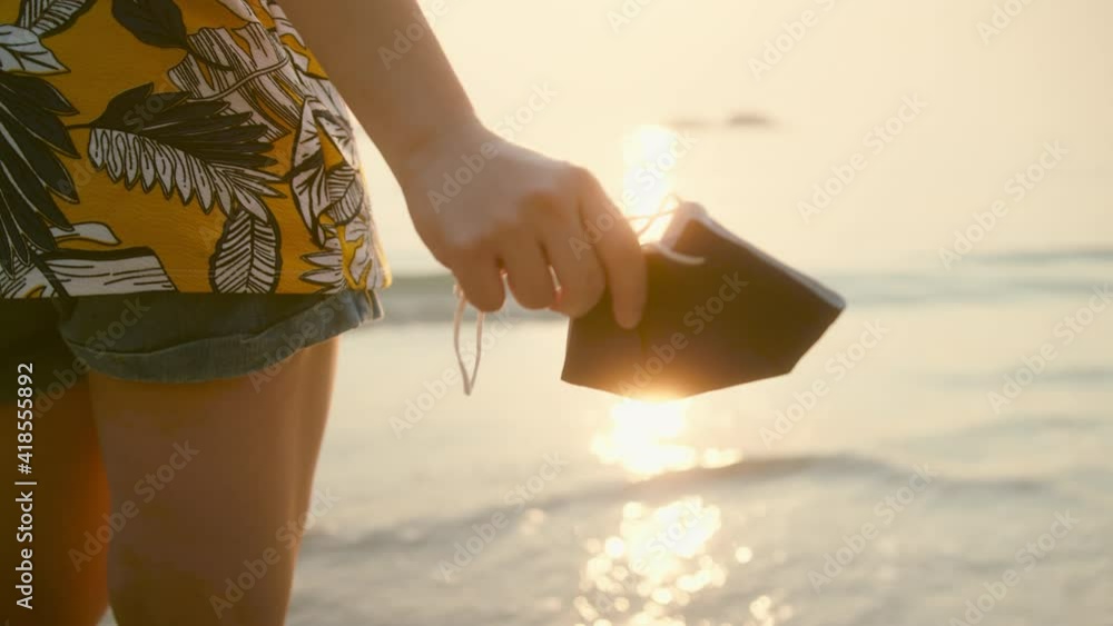 close up female hand take off virus protective face mask out hand pull ...