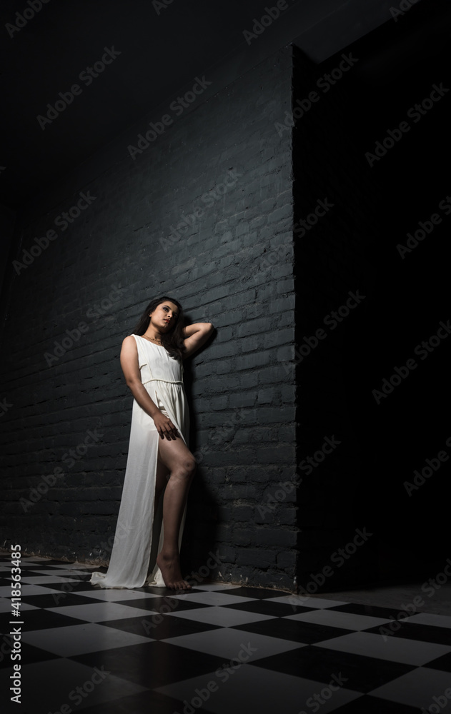 Indian girl, caucasian, brunette girl in white one leg cut gown with ...
