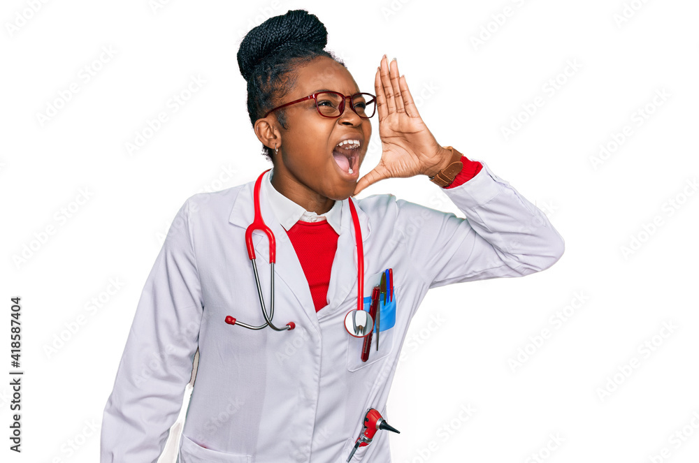 Young african american woman wearing doctor uniform and stethoscope ...