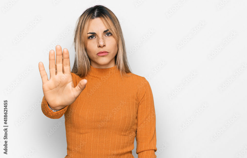 Young caucasian woman wearing casual clothes doing stop sing with palm ...