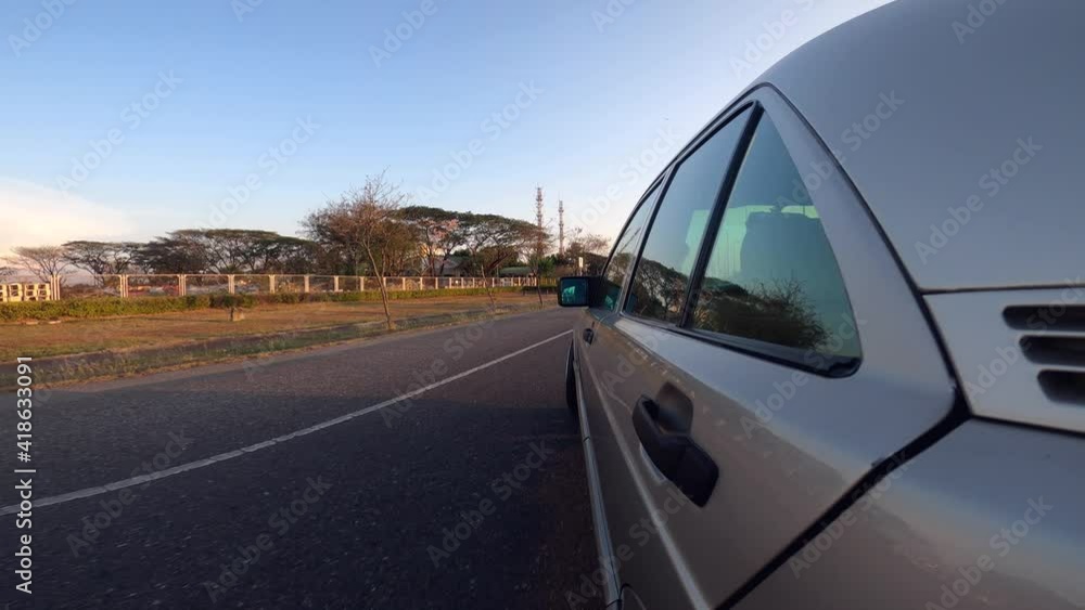 Driving view from side view of the car with reflection on the window ...