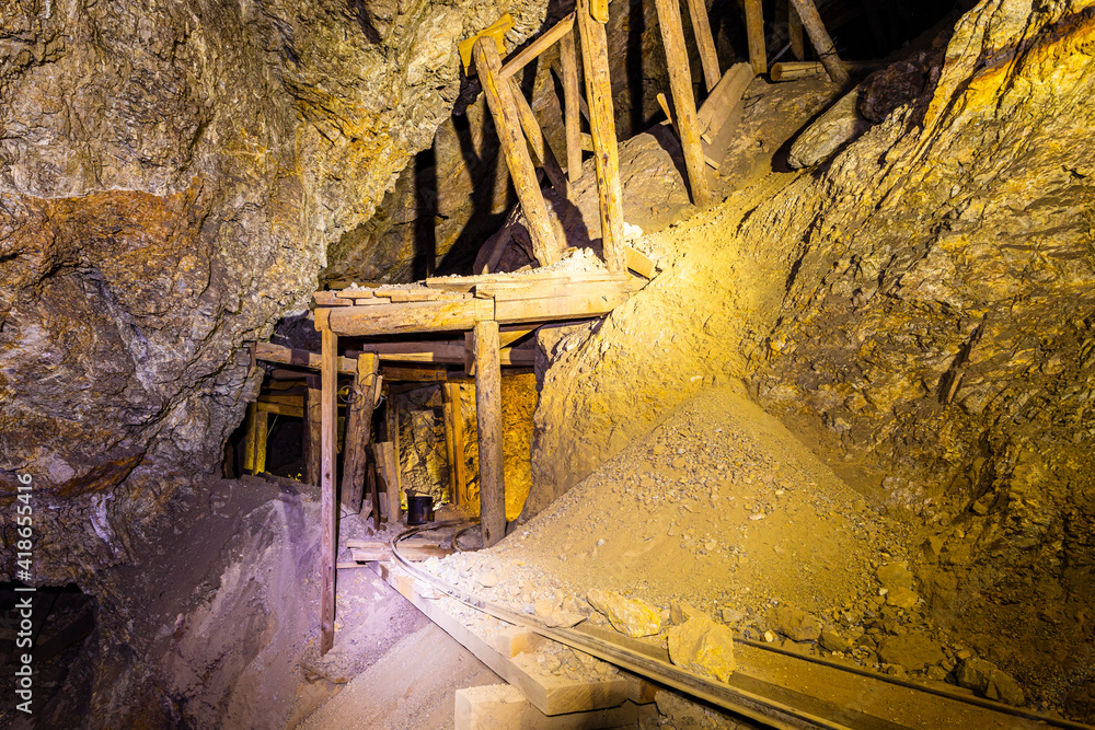 Square timber framing inside an old and abandoned gold mine in ...