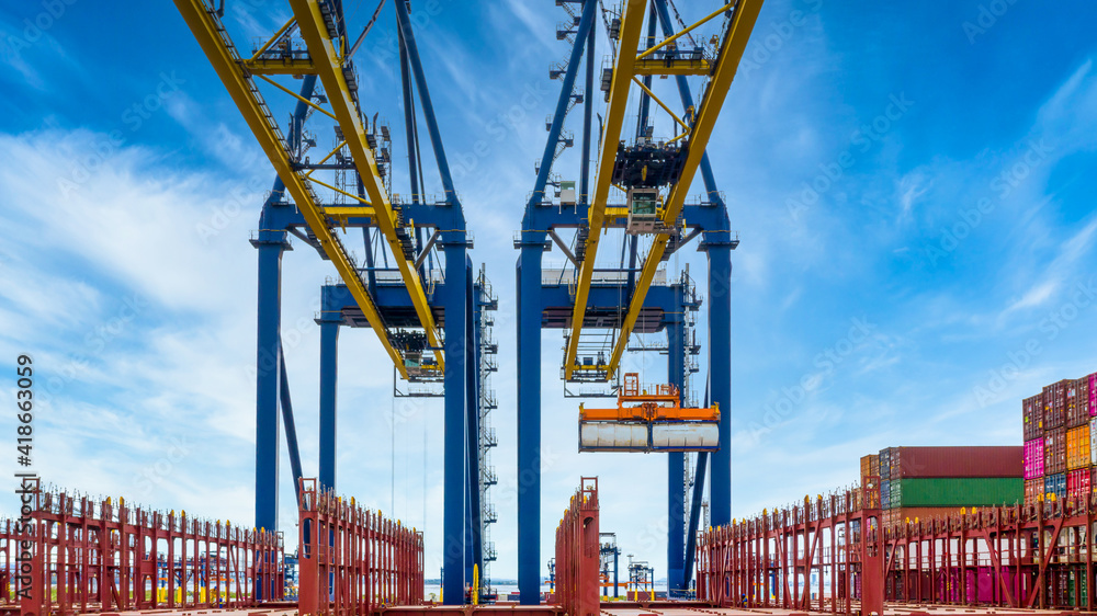 Container ship loading and unloading in deep seaport, Aerial view of ...