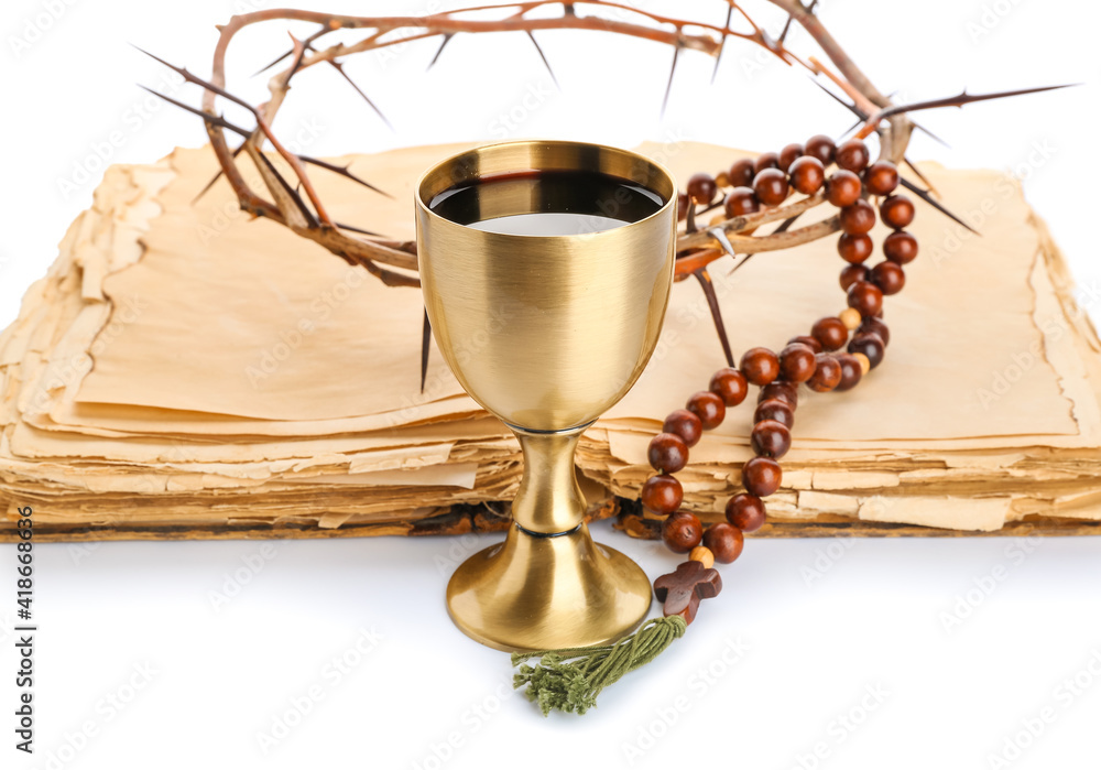 Holy Bible with chalice of wine, beads and crown of thorns on white ...