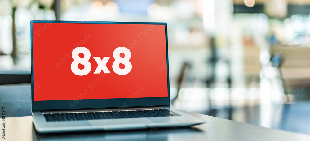 Laptop computer displaying logo of 8x8 Inc. Stock Photo | Adobe Stock