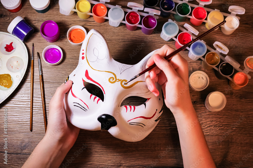 A cat mask design making by teenage girl. Drawing, creativity, hobby ...