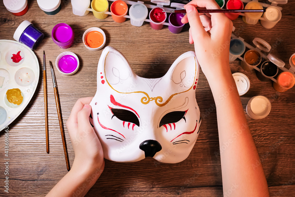 A cat mask design making by teenage girl. Drawing, creativity, hobby ...