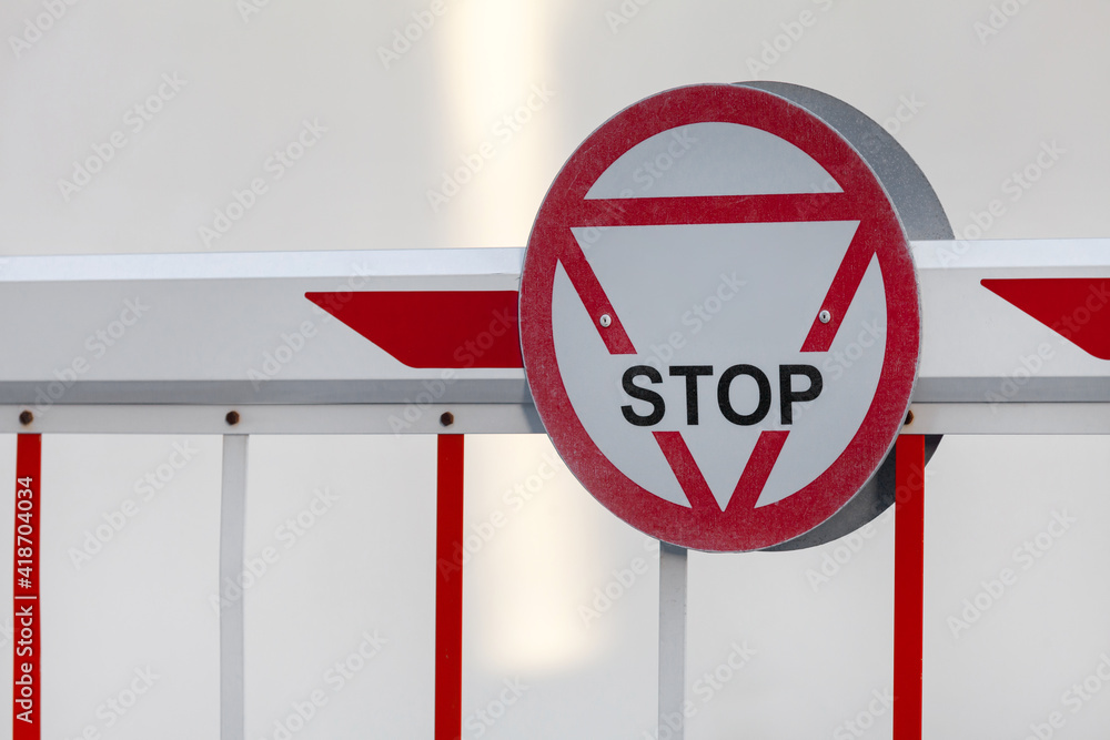 Stop sign at the gate, warning sign, triangle Stock Photo | Adobe Stock