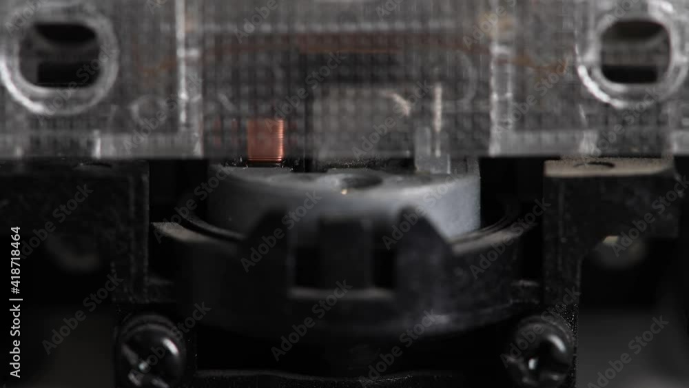 Tape recorder head and roller assembly. Close-up of a reel for a drum ...