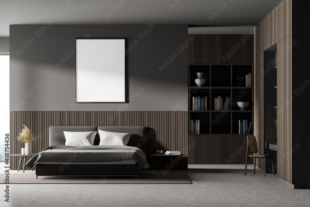 Front view of a bedroom with king size bed, a bookshelf, a table and a ...
