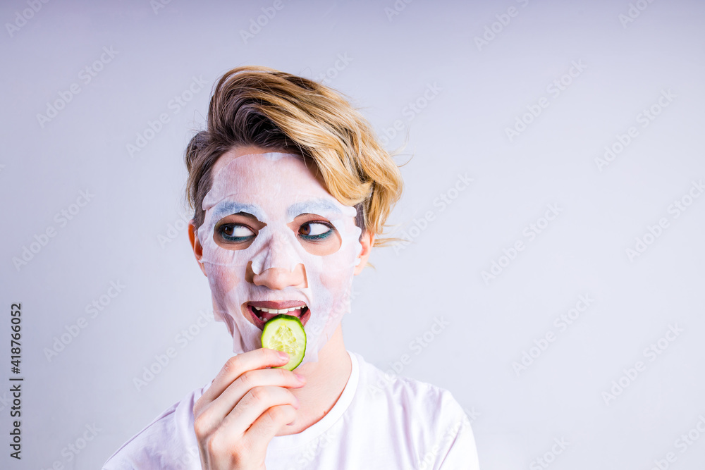 non binary portrait of asian man with luxurious blonde hair and ...