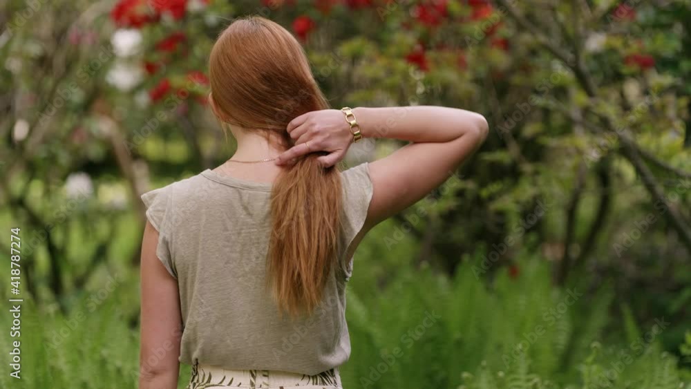 [4k] beautiful long hair ginger woman sorting hair in back view before ...