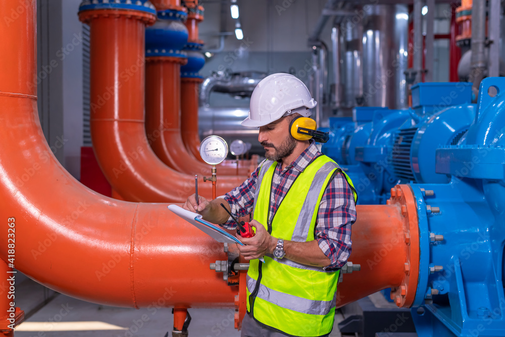 Engineer under checking the industry cooling tower air conditioner is ...